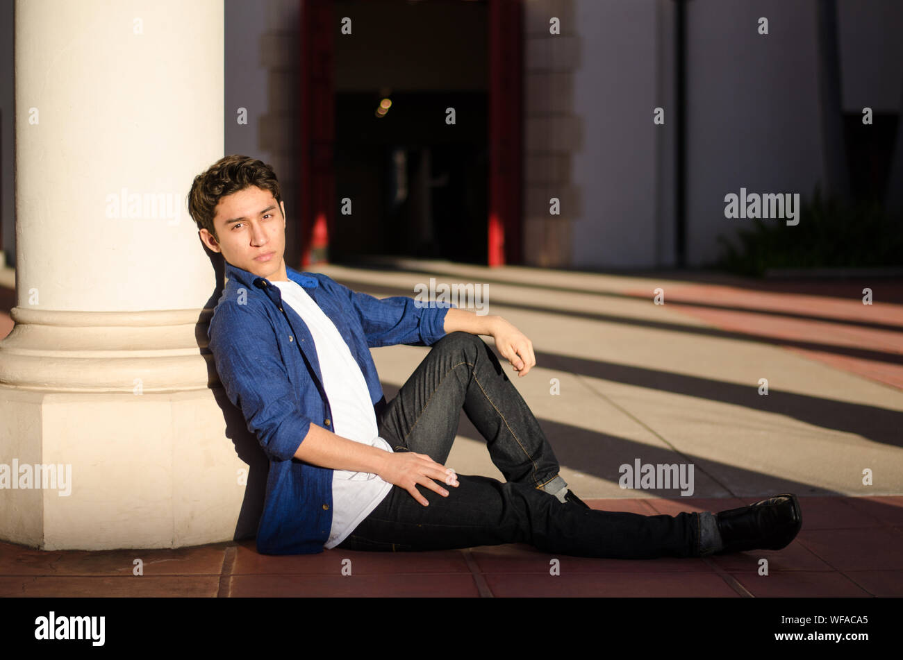 Young man leaning on column hi-res stock photography and images - Alamy