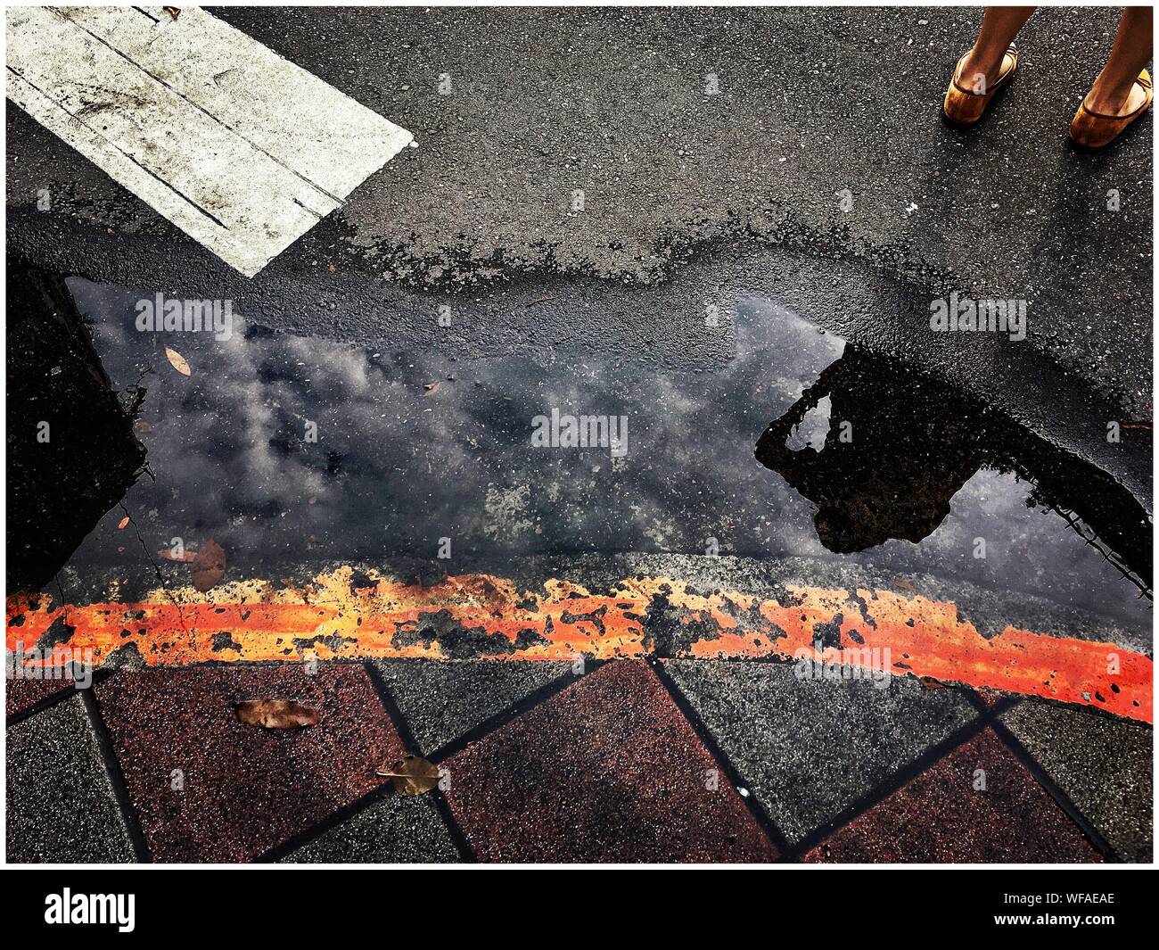Reflection woman puddle city hi-res stock photography and images - Alamy