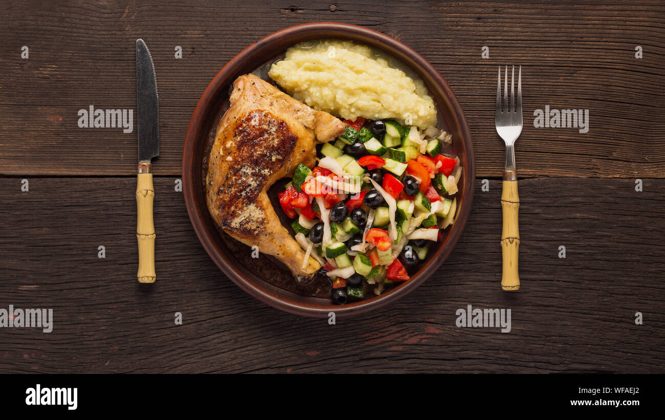 Complete lunch in the diner. Delicious chicken legs, vegetable salad ...