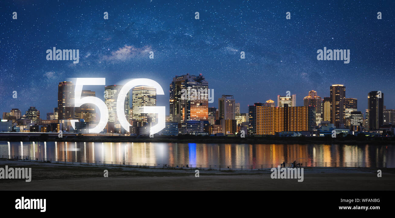 5G wireless internet technology in the city, Osaka city at night in ...