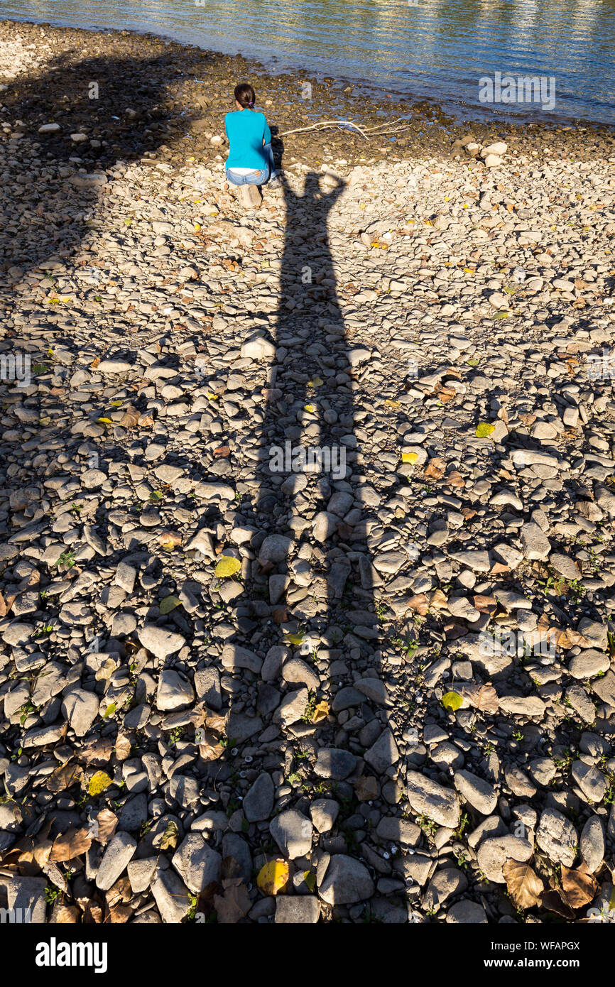 Shadow of man sitting hi-res stock photography and images - Alamy