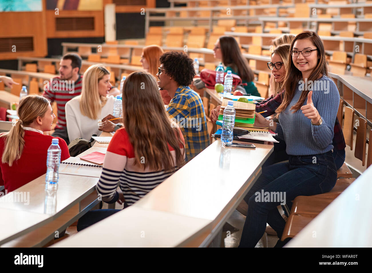 Smiling girl students at class of university Stock Photo - Alamy
