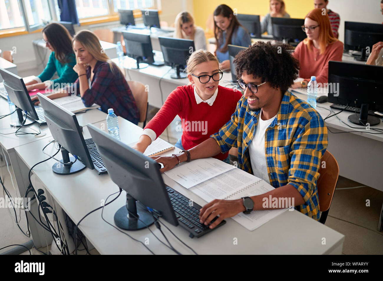 Group students table teacher hi-res stock photography and images - Alamy
