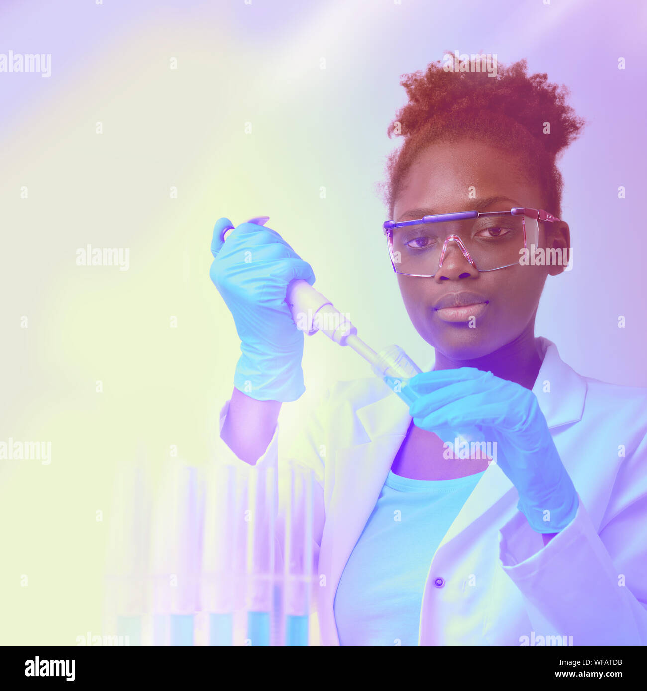 African scientist or graduate student in lab coat and protective wear ...