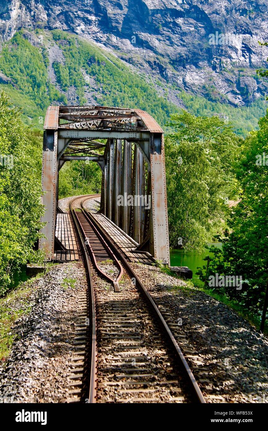 Railroad Tracks By Mountain Stock Photo - Alamy