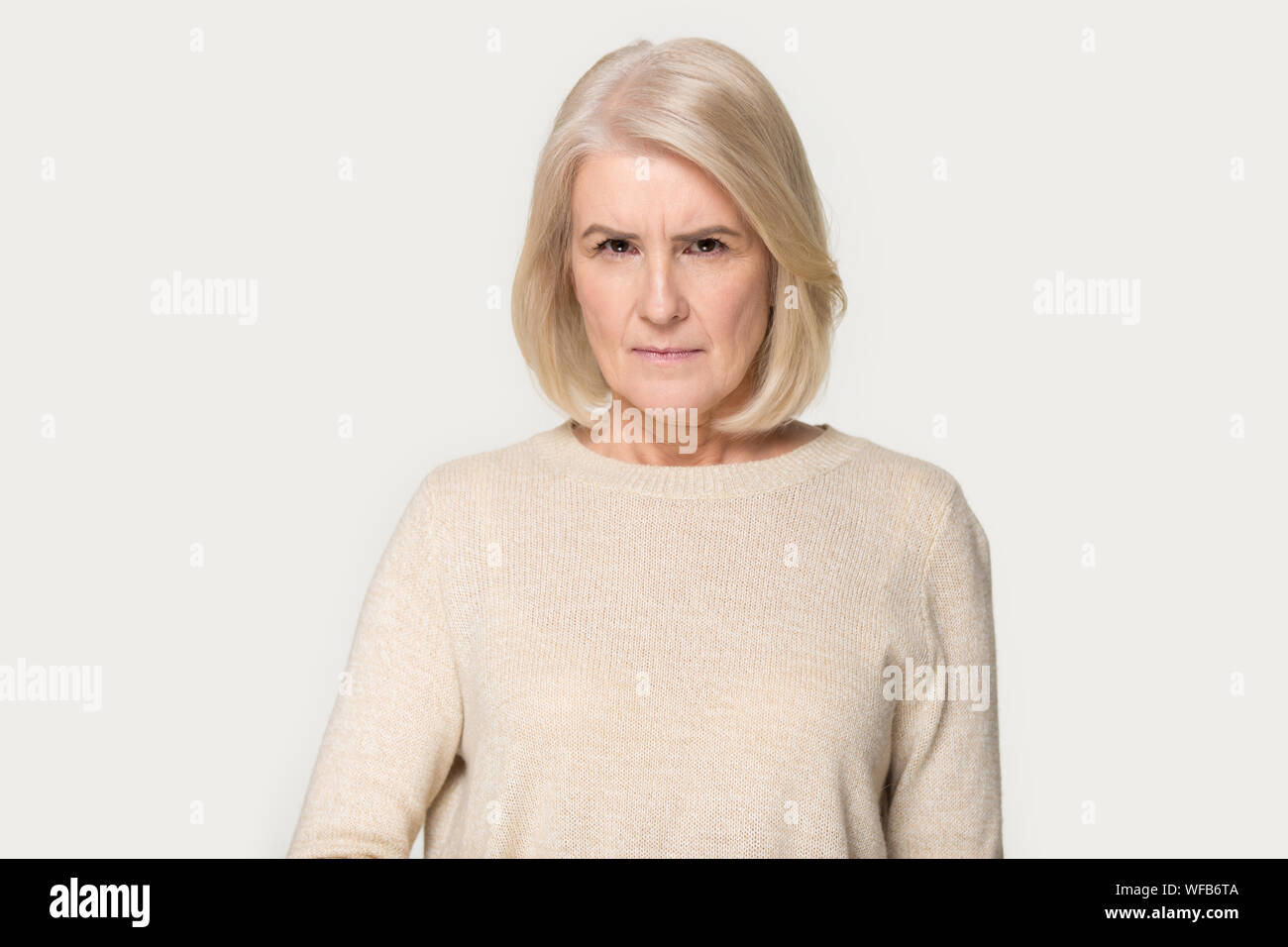 Mad senior woman feel dissatisfied look angrily at camera Stock Photo ...