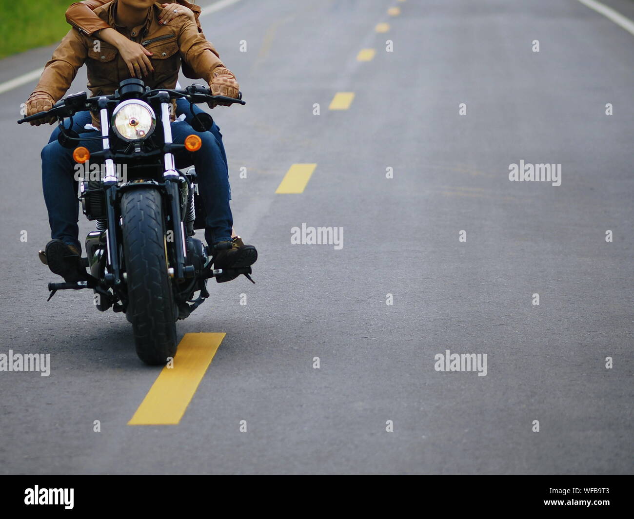 Couple riding on motorcycle hi-res stock photography and images - Alamy