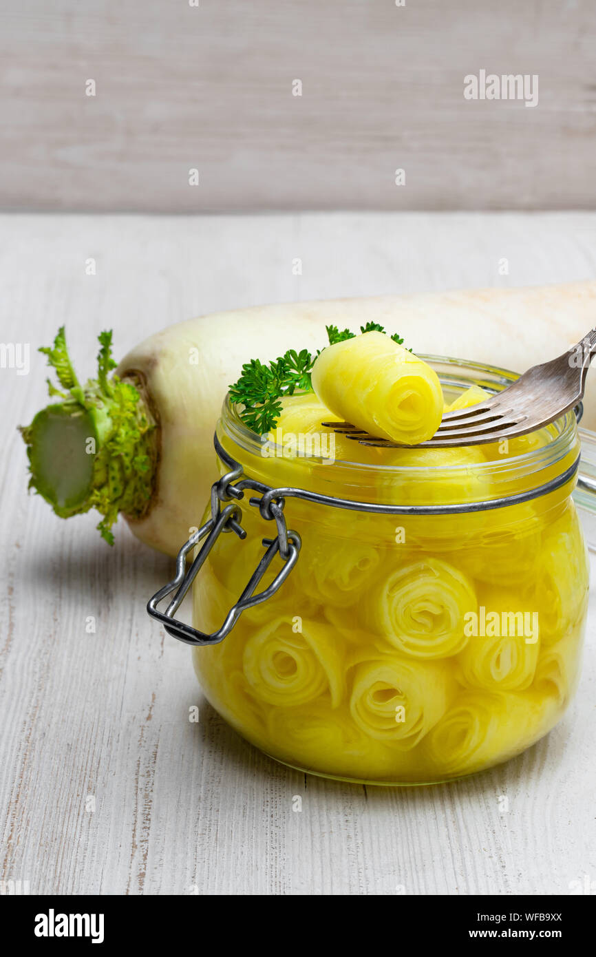 Marinated daikon on white background in the glass jar Stock Photo - Alamy