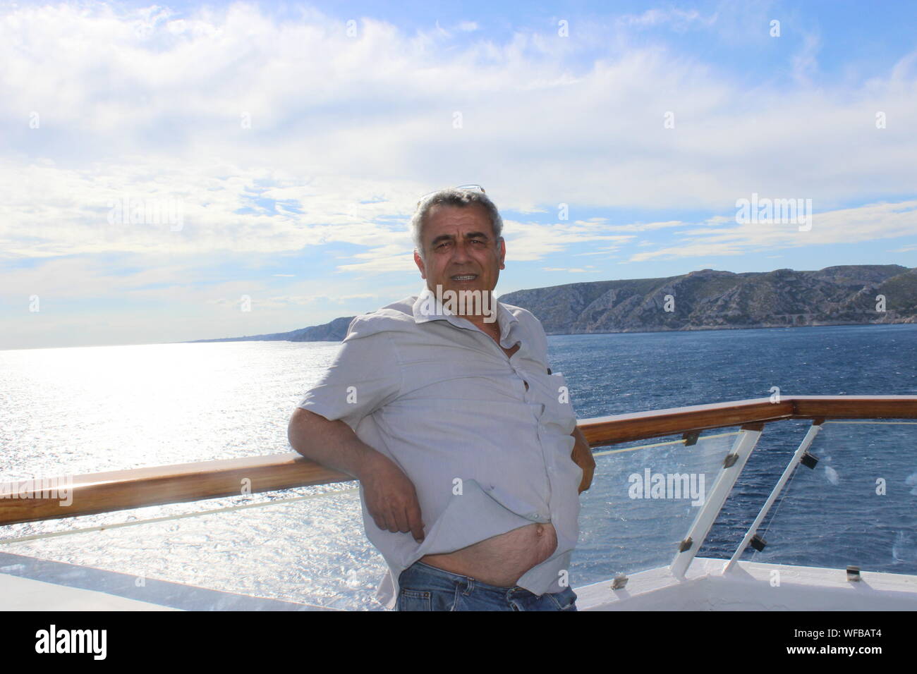 Man leaning over railing hi-res stock photography and images - Alamy