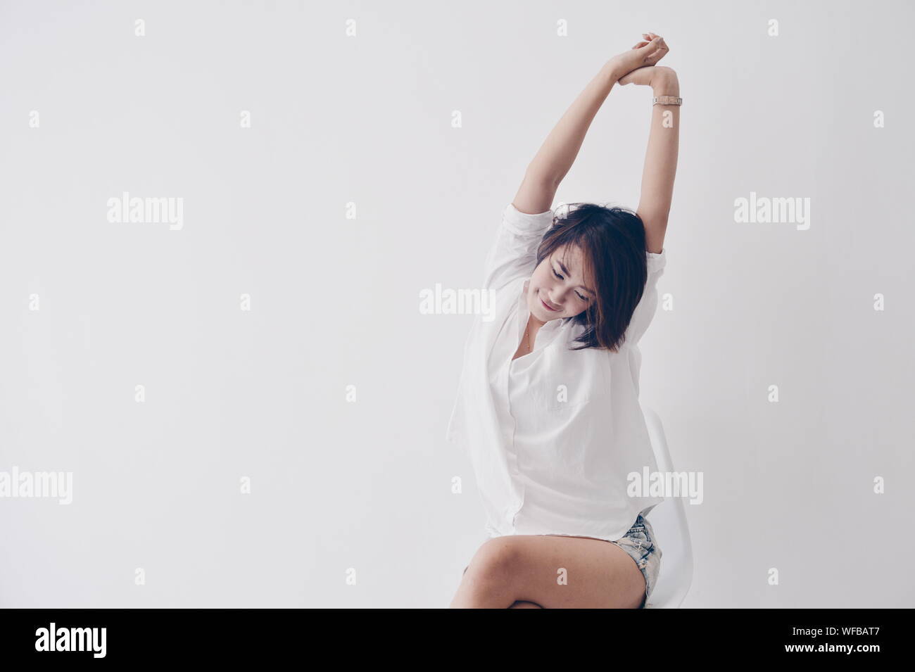 Stretching sitting hi-res stock photography and images - Alamy