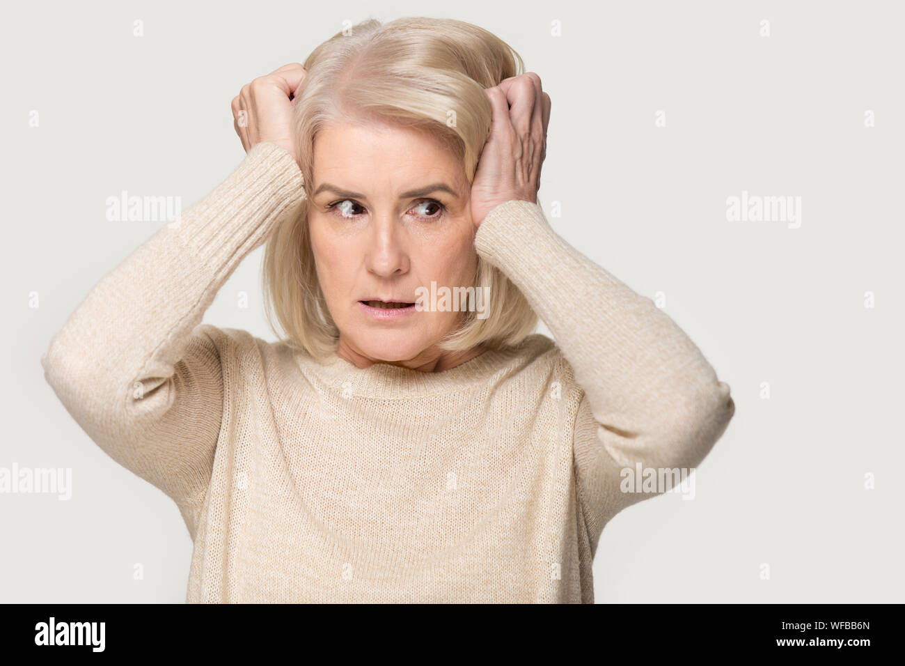 Sacred mature woman feel terrified freaking out Stock Photo - Alamy