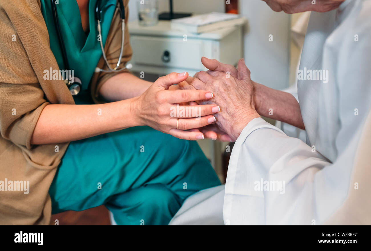 Nurse Consoling Senior Patient In Hospital Stock Photo - Alamy