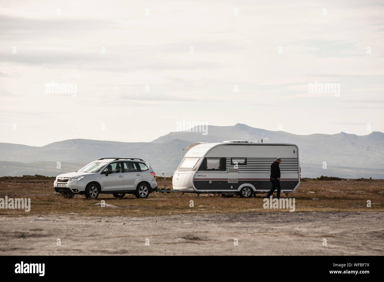 A car with a caravan Stock Photo - Alamy