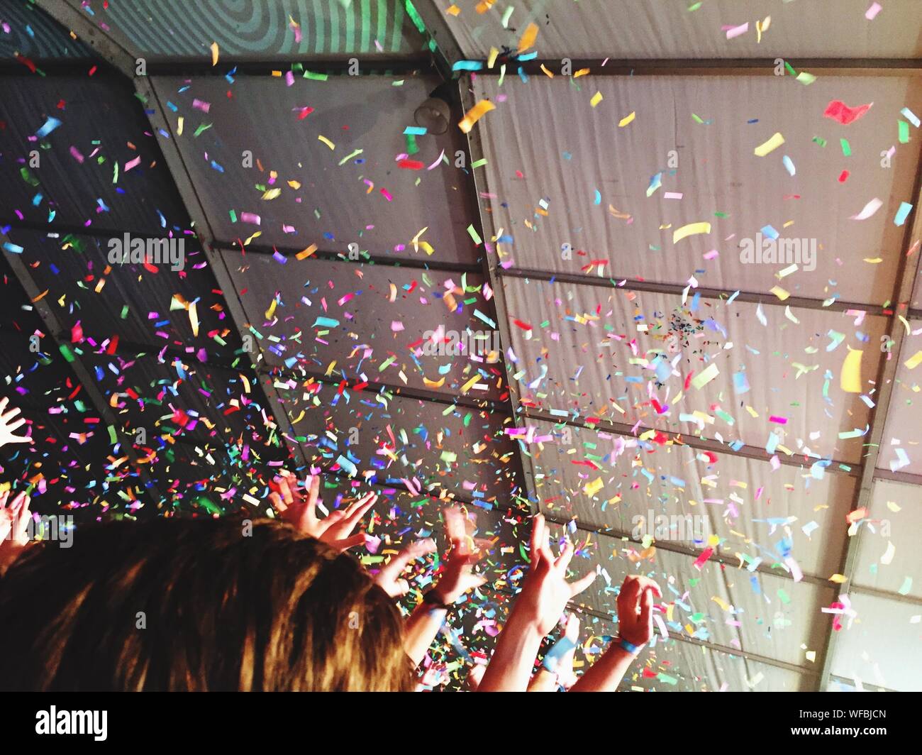 Group people arms up confetti hi-res stock photography and images - Alamy