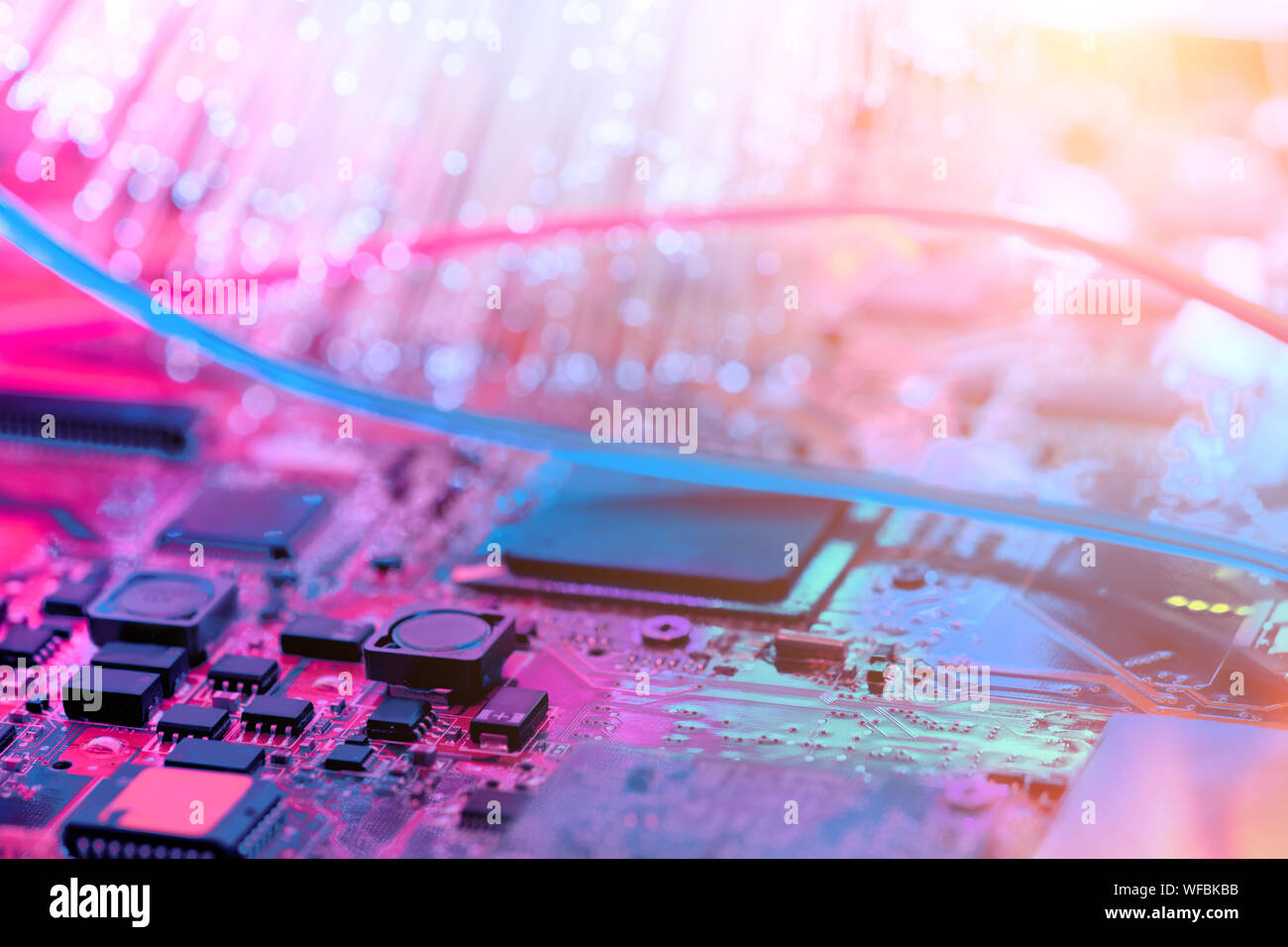 Closeup on electronic board and neon electric lights, blurred and toned ...