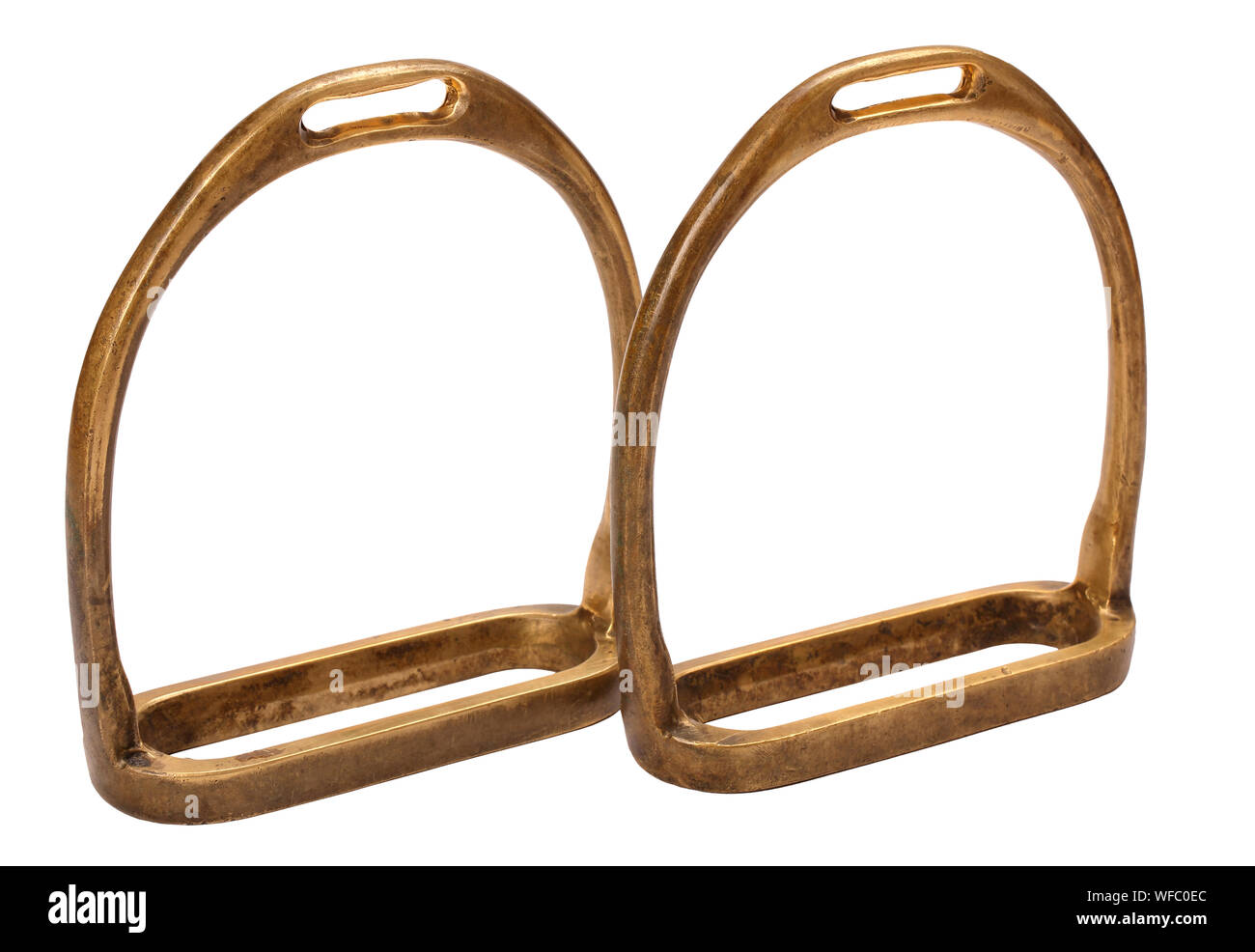 Old golden stirrup isolated on white background Stock Photo - Alamy