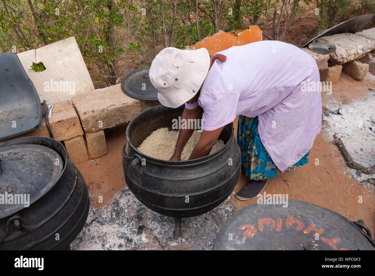 Traditional African food, rice, cooked outdoors in the yard Stock Photo ...