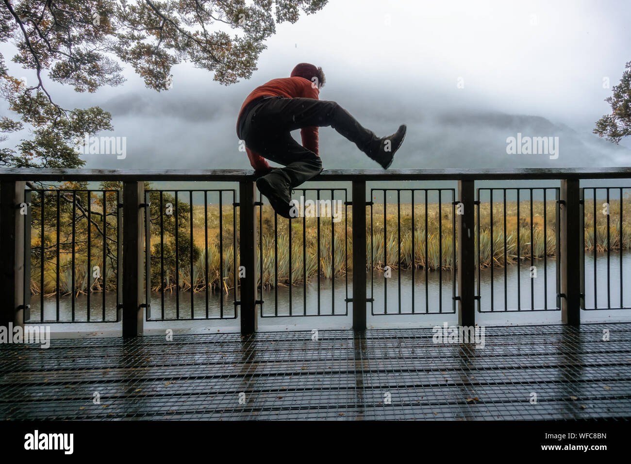 Man jumping over fence hi-res stock photography and images - Alamy