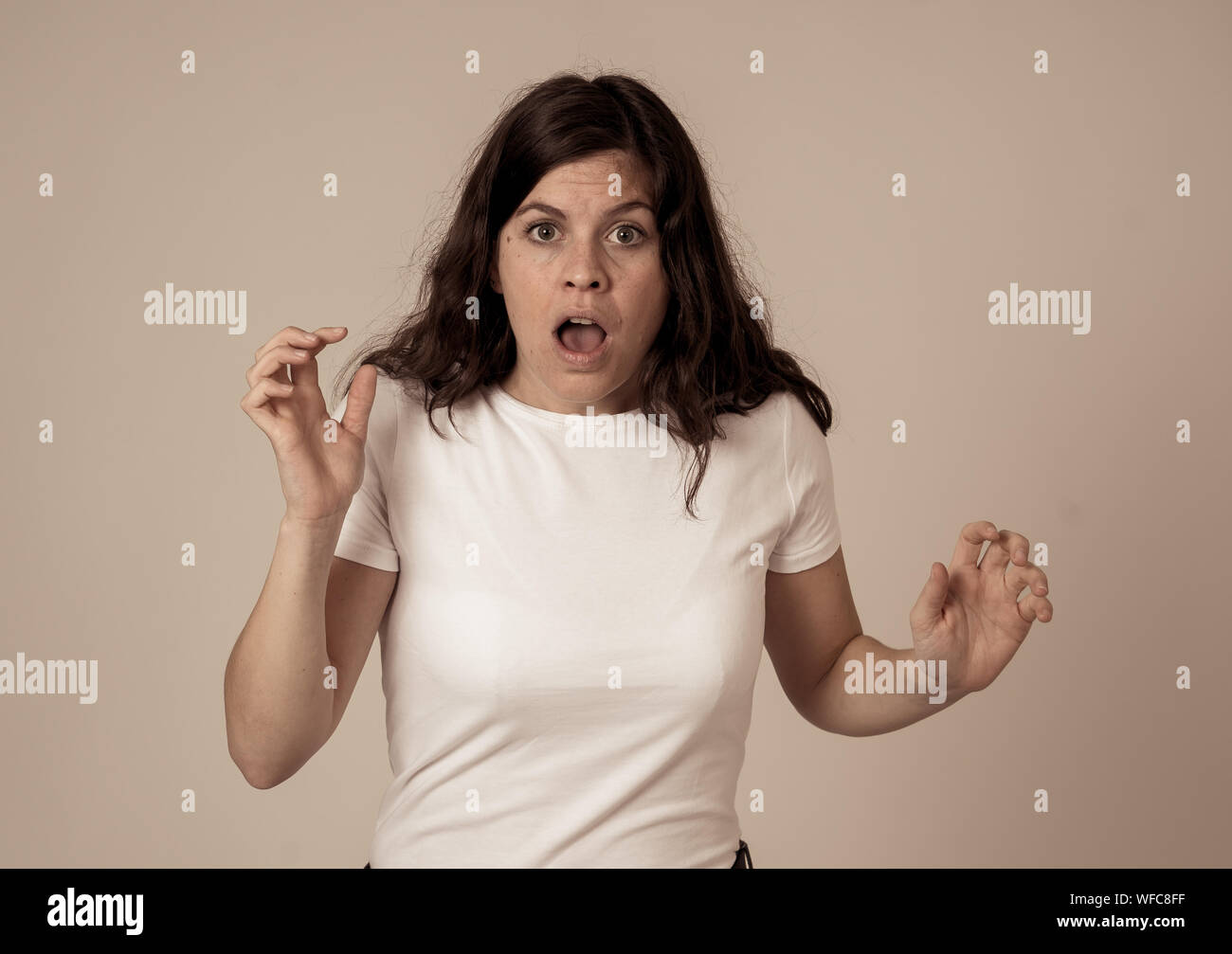 Young Woman Feeling Scared And Shocked Making Fear Anxiety Gestures