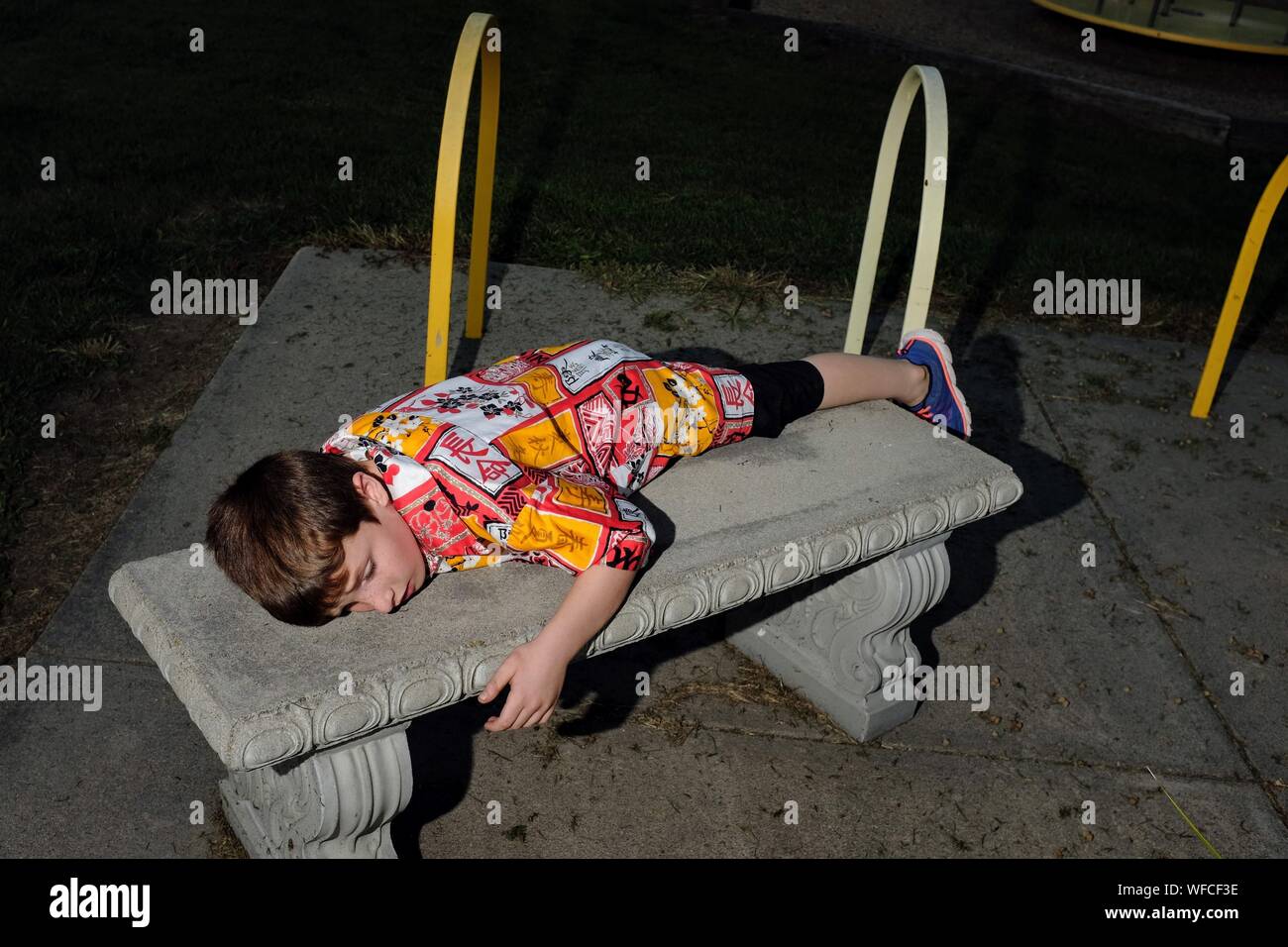 Boy Lying Down On Bench High Resolution Stock Photography and Images ...