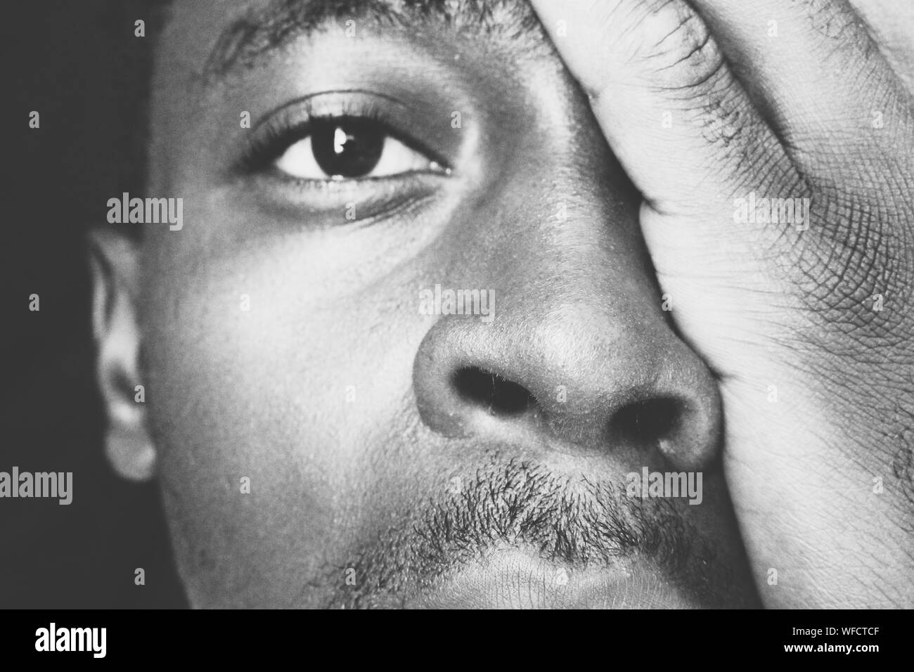 Hand covering eye hi-res stock photography and images - Alamy