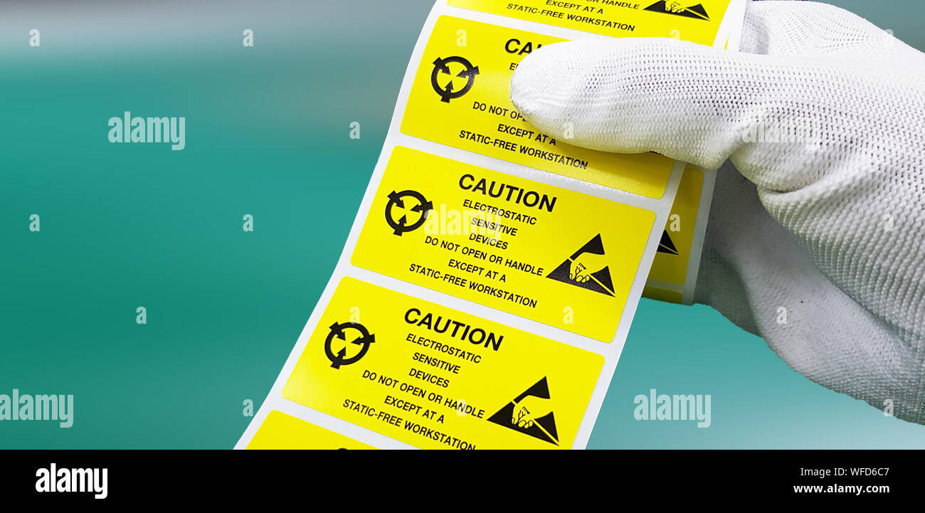 Hand holding ESD symbol label with antistatic gloves,Electrostatic ...