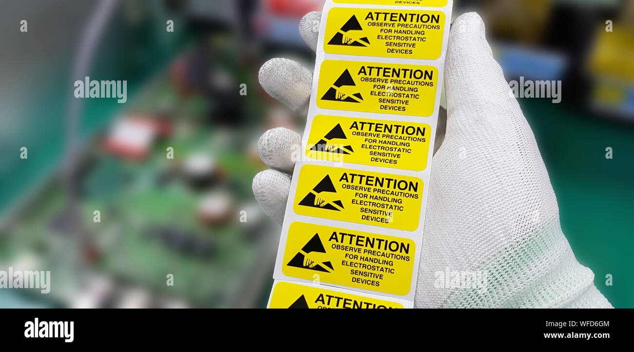 Hand holding ESD symbol label with antistatic gloves,Electrostatic ...