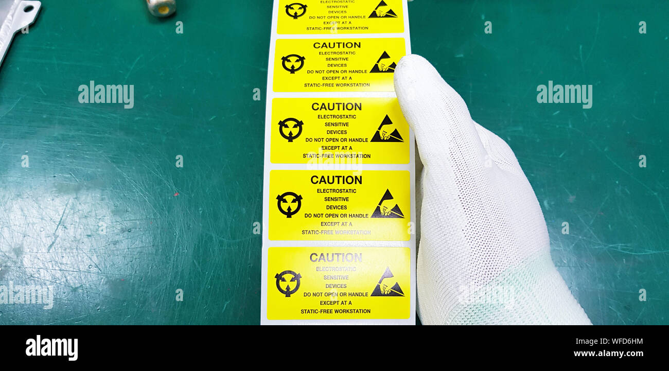 Hand holding ESD symbol label with antistatic gloves,Electrostatic ...