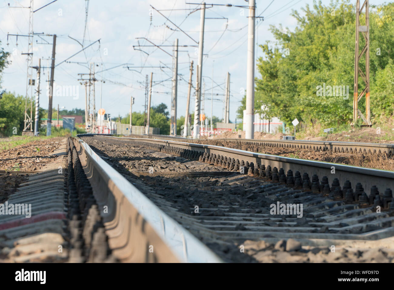 long railroad tracks with landscape against the sky Stock Photo - Alamy