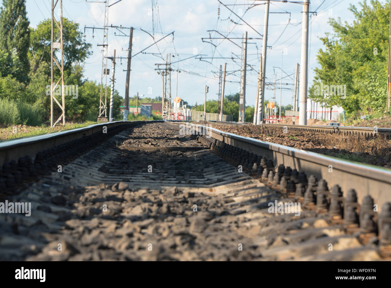 long railroad tracks with landscape against the sky Stock Photo - Alamy