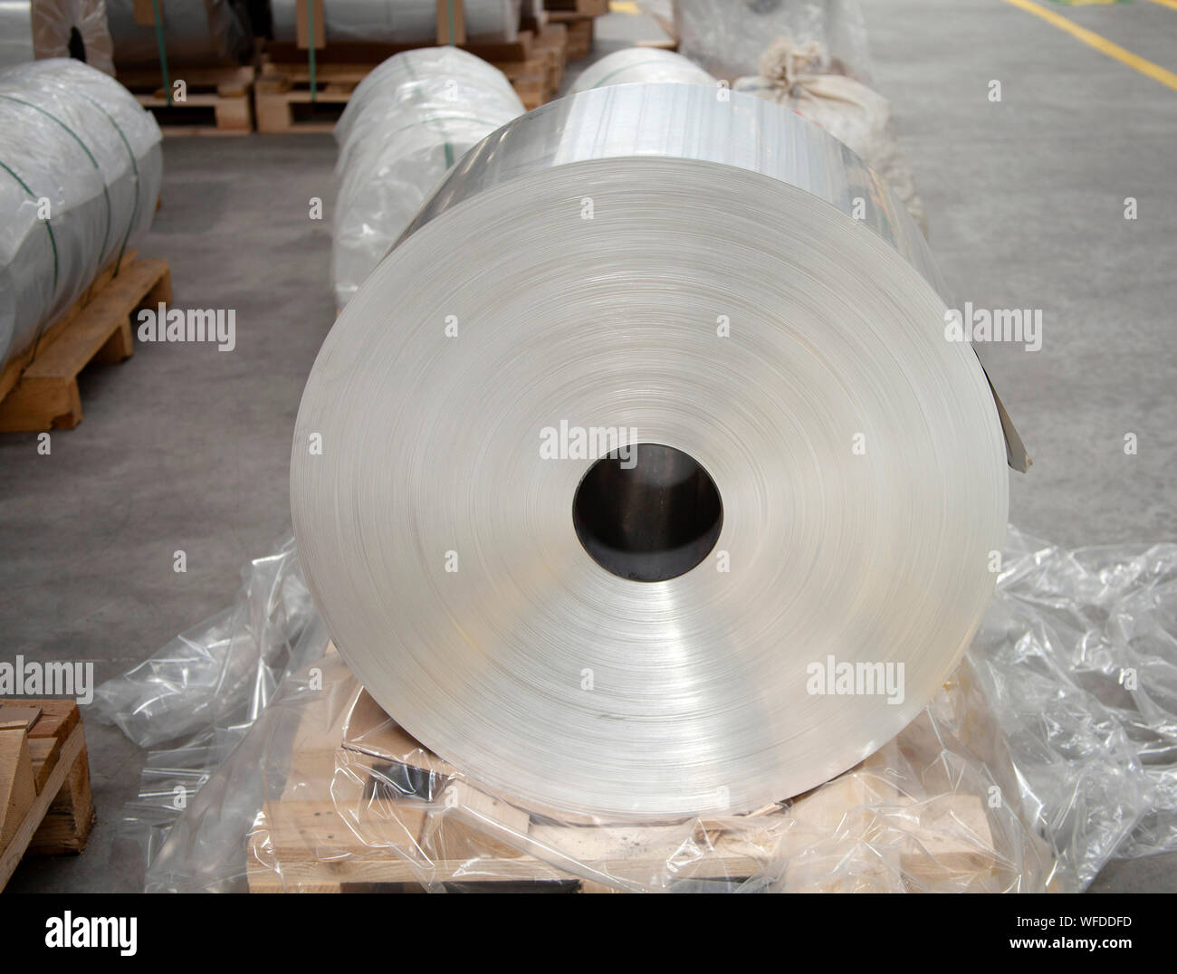 Steel sheets rolled up into rolls Stock Photo - Alamy