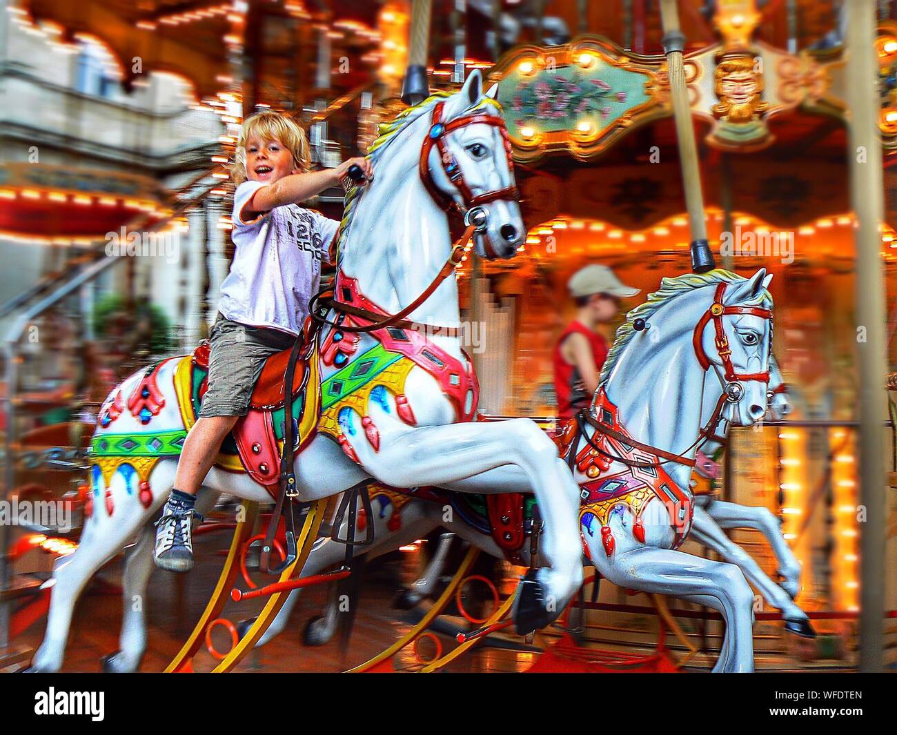 Riding carousel horses hi-res stock photography and images - Alamy