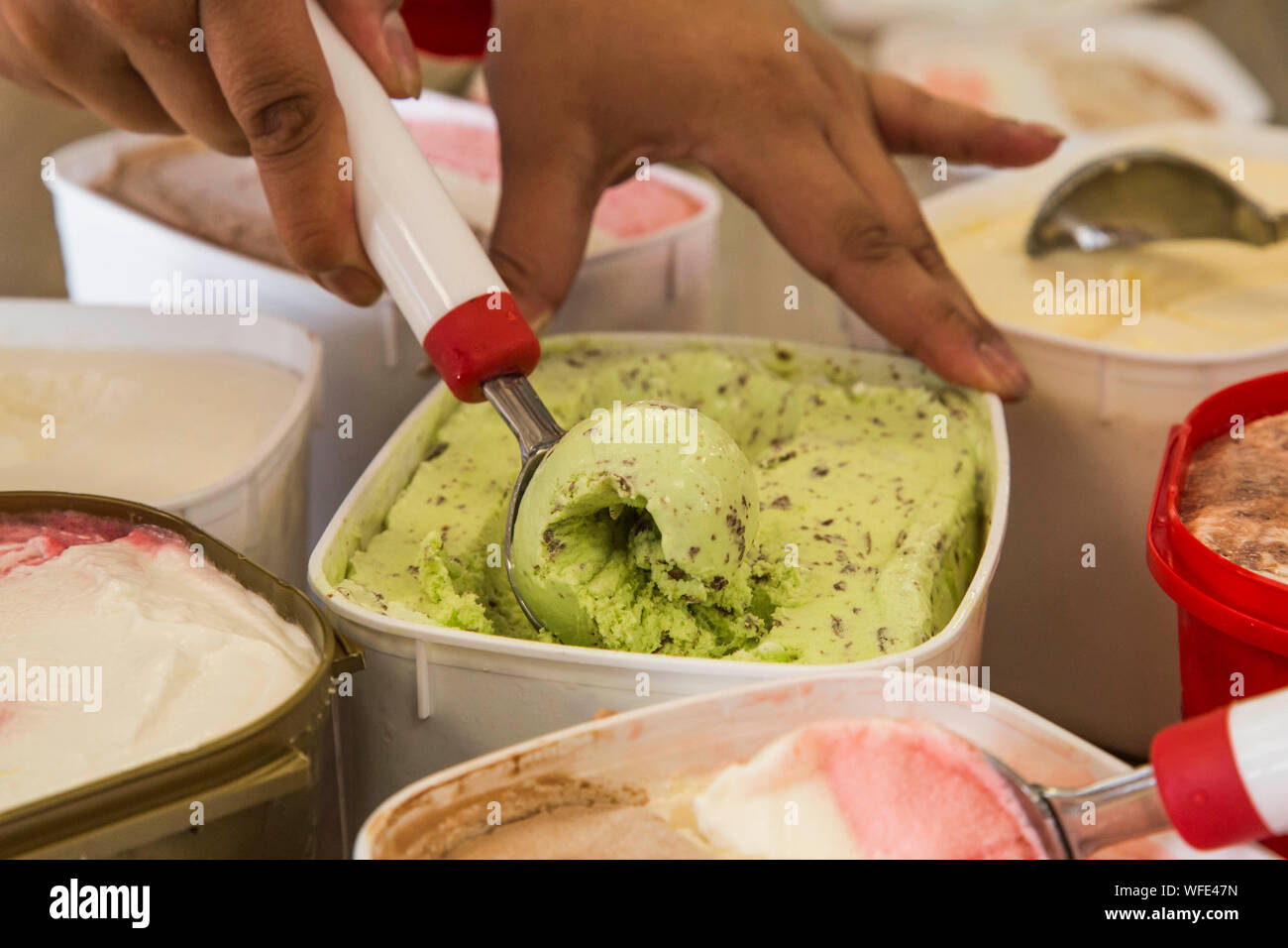 Hand scooping ice cream hi-res stock photography and images - Alamy