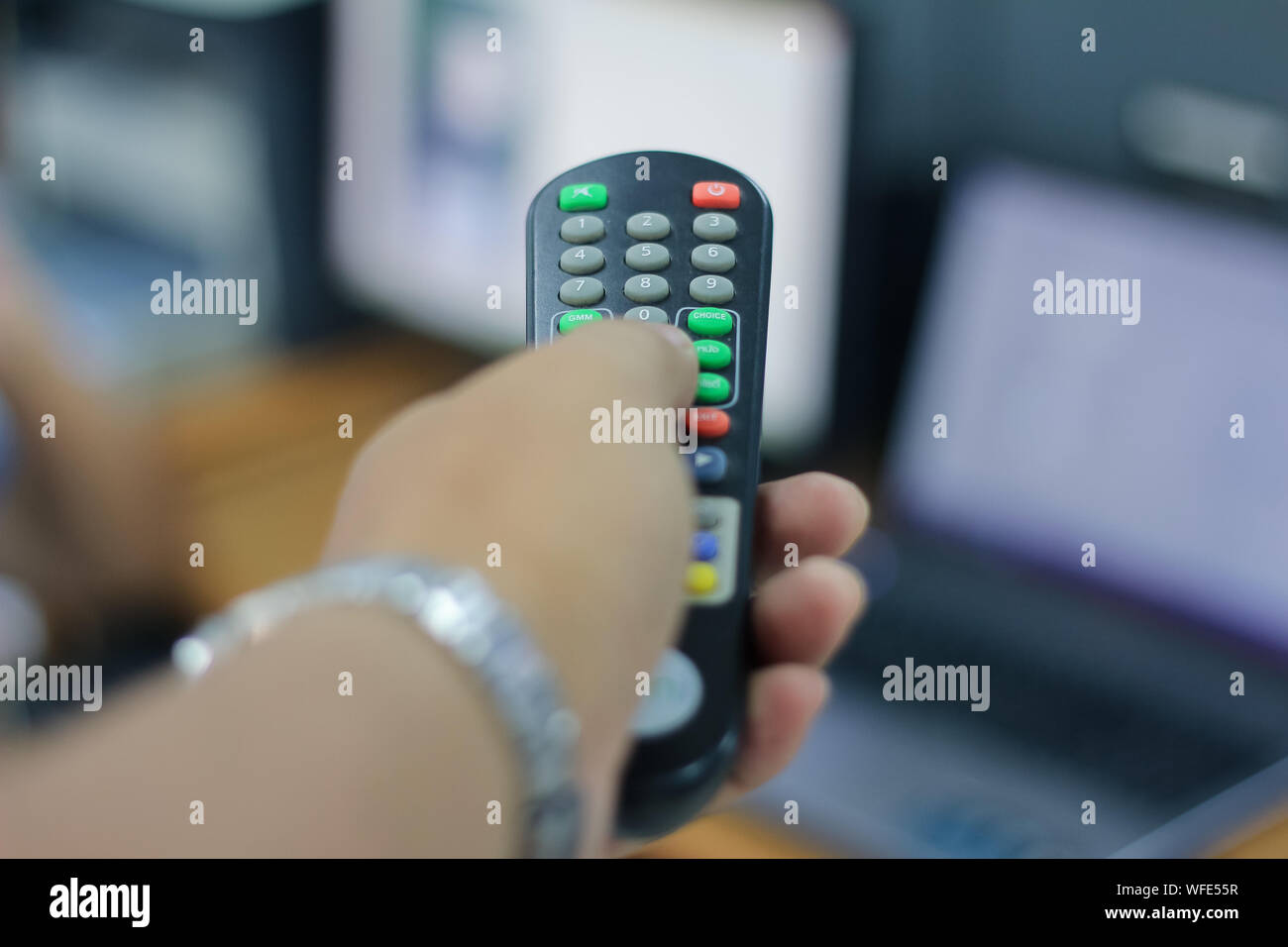 Hand Holding Remote Control Stock Photo - Alamy