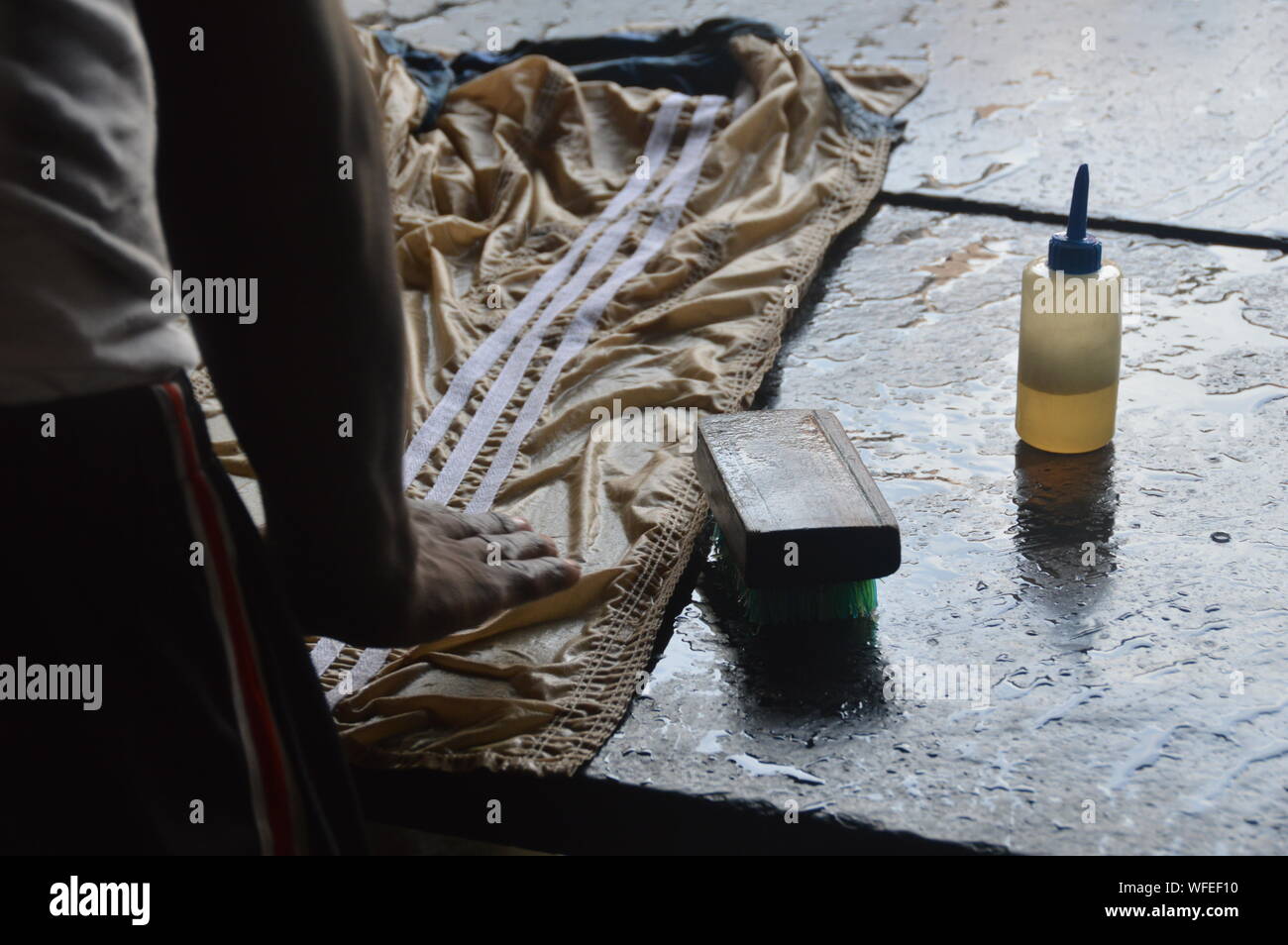 Person washing clothes hi-res stock photography and images - Alamy