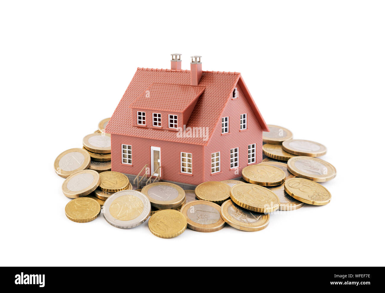 Miniature house and euro coins Cut Out Stock Images & Pictures - Alamy