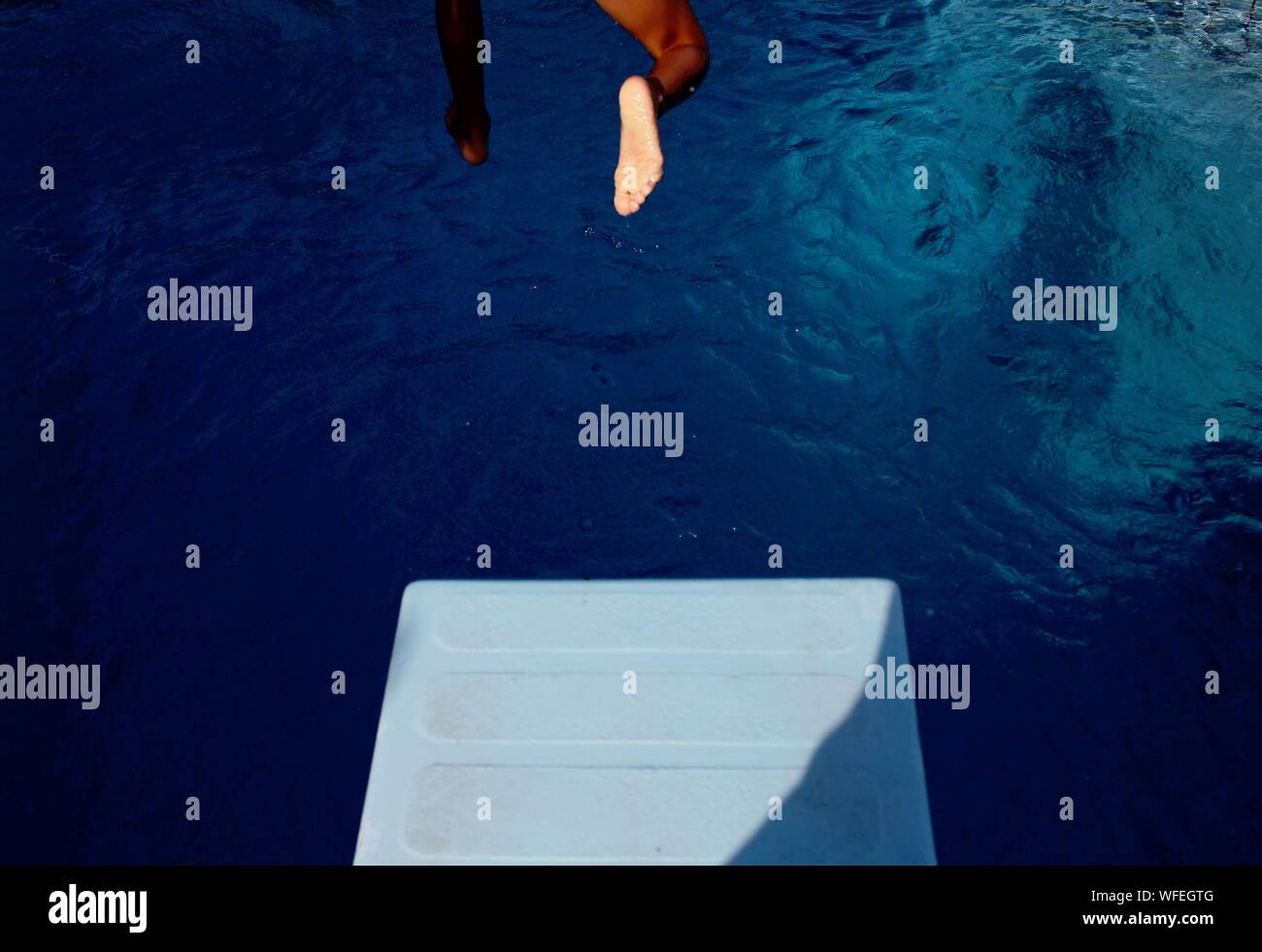 Man jumping swimming pool hi-res stock photography and images - Alamy