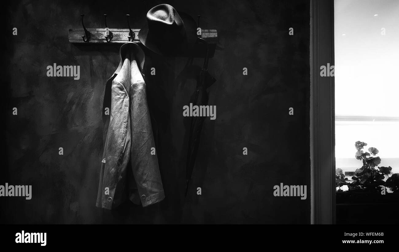 Hat hanging on hook hi-res stock photography and images - Alamy