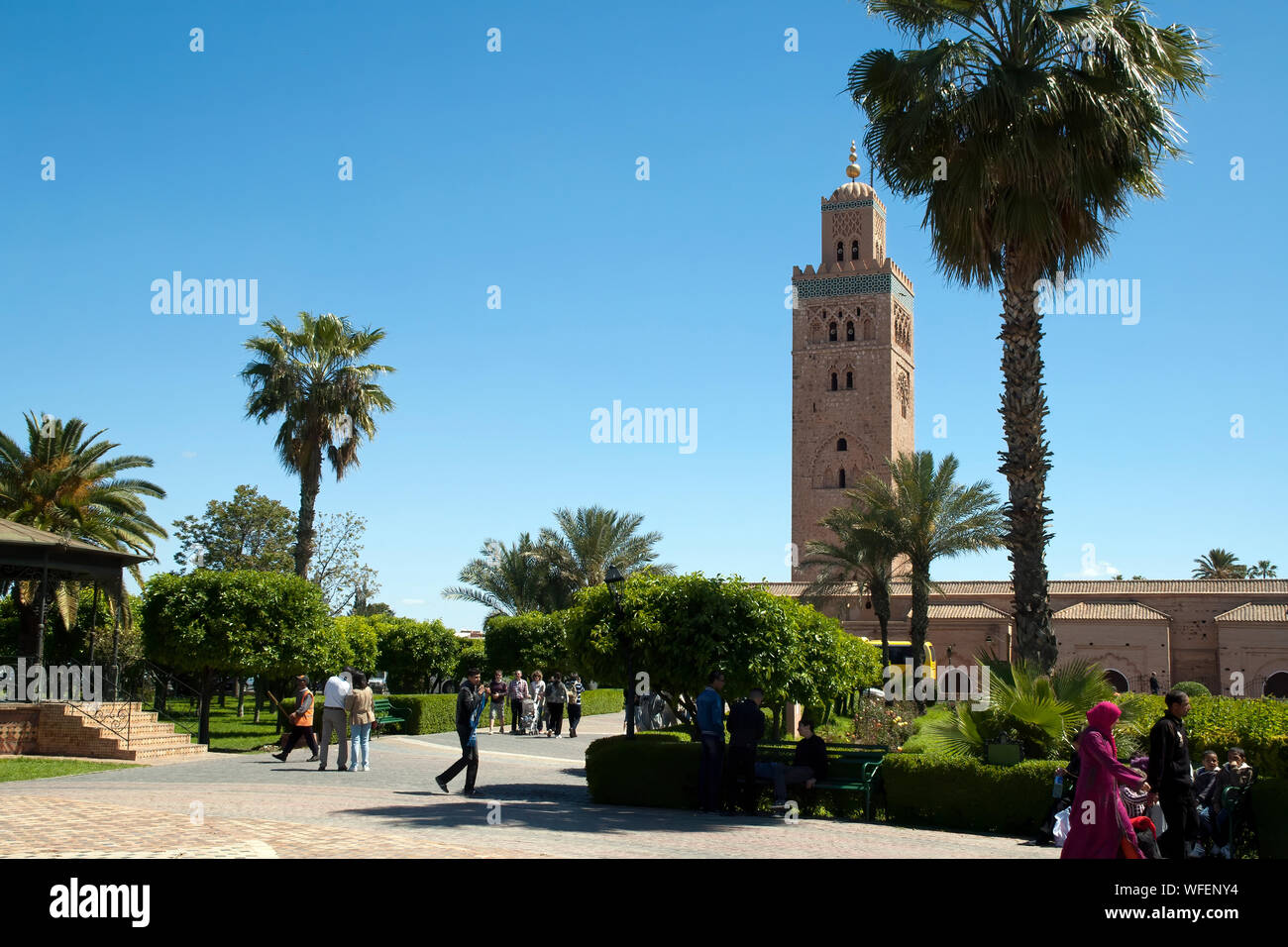 Marrakesh Morocco, street scene in park with Koutoubia Mosque in ...