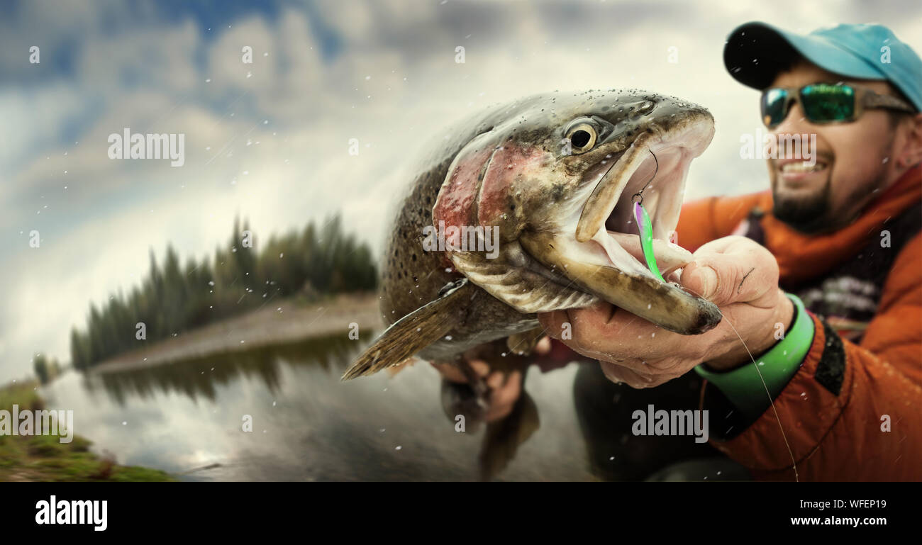 Fishing background Fisherman and trout Stock Photo - Alamy
