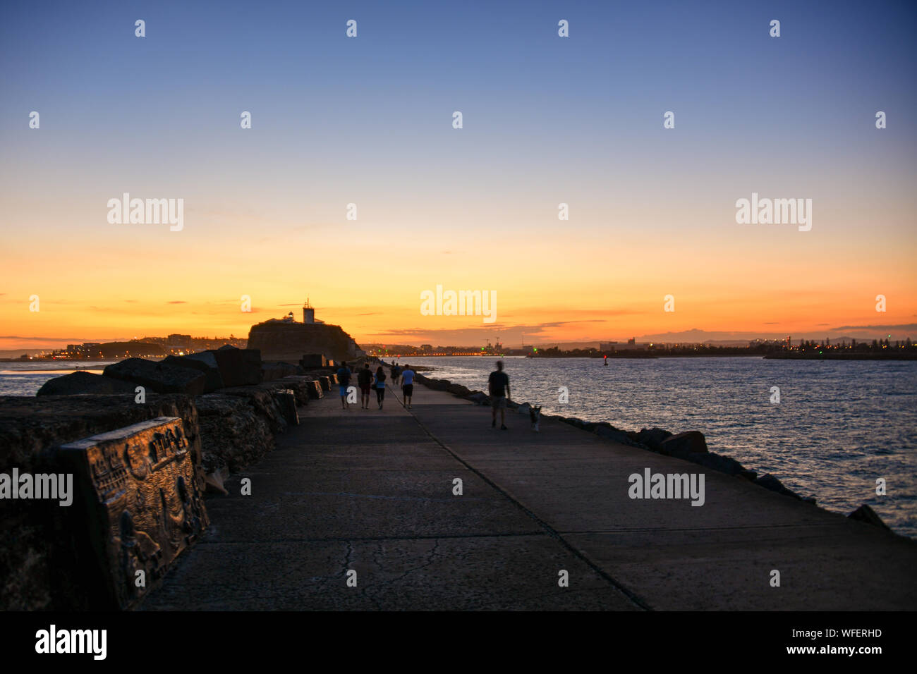 Nobbys Head Break Wall with Lighthouse and Harbour Entrance with Sunset ...
