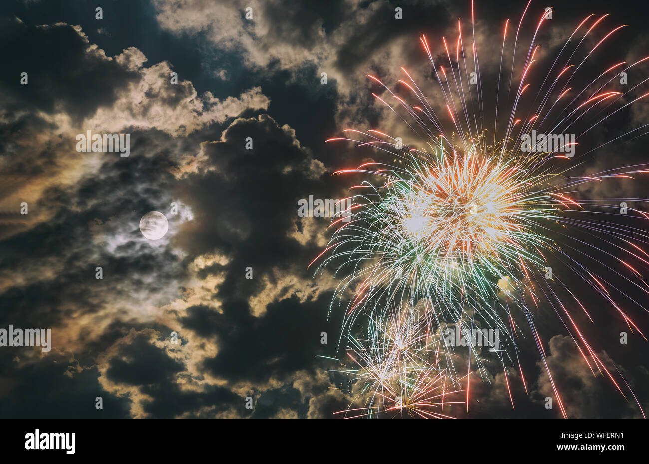 Colorful amazing fireworks with the full moon in fireworks festival ...