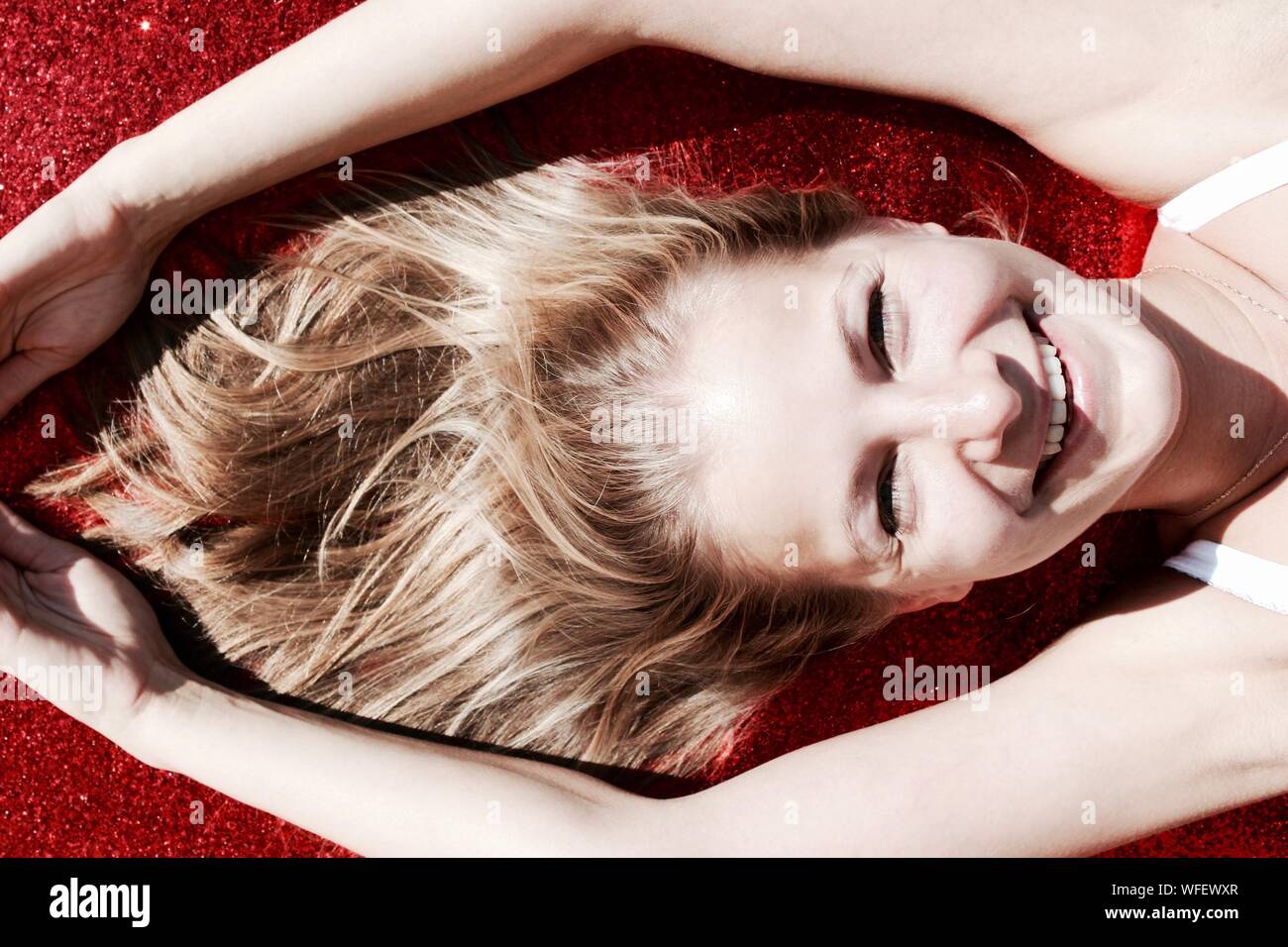 Young woman lying on back hi-res stock photography and images - Alamy