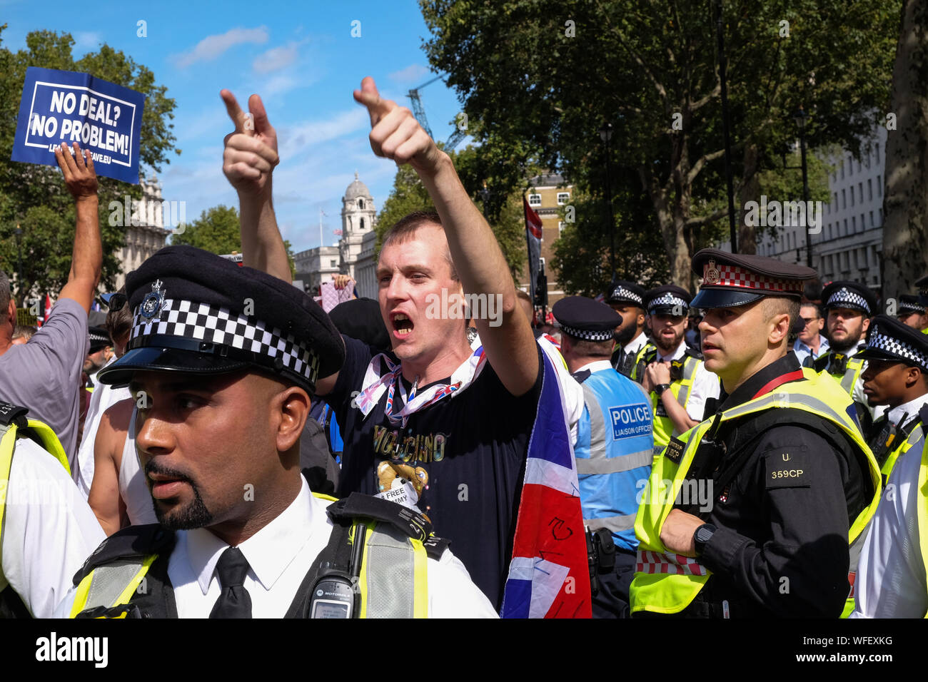 Whitehall, London, UK. 31st August 2019. Tommy Robinson supporters pass ...