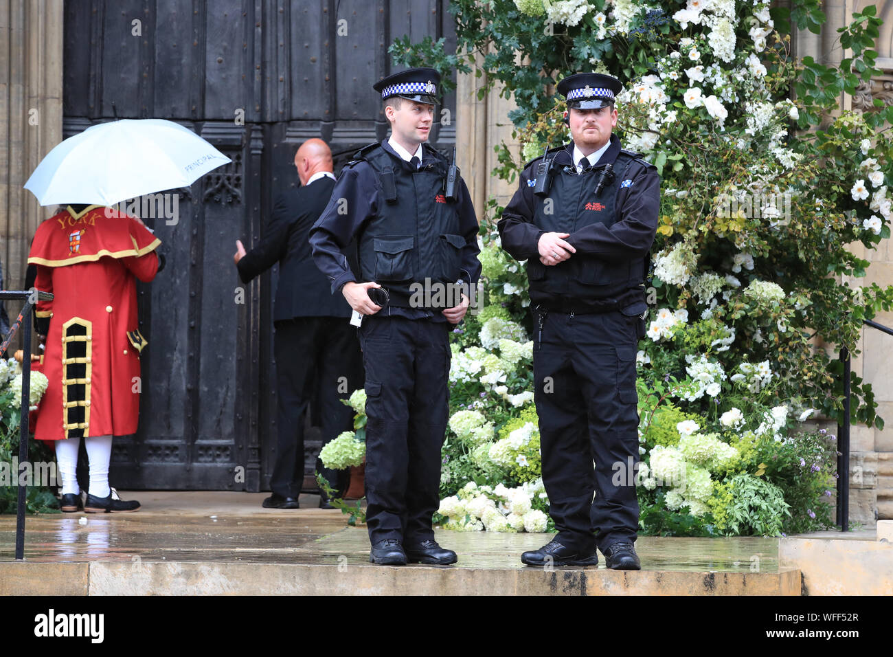Police officers in rain hi-res stock photography and images - Alamy