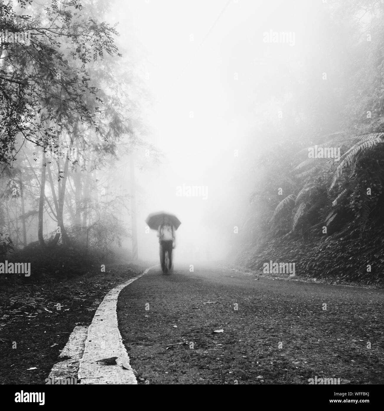 Man walking road empty hi-res stock photography and images - Alamy