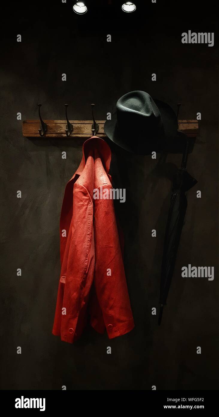 Hat hanging on hook hi-res stock photography and images - Alamy