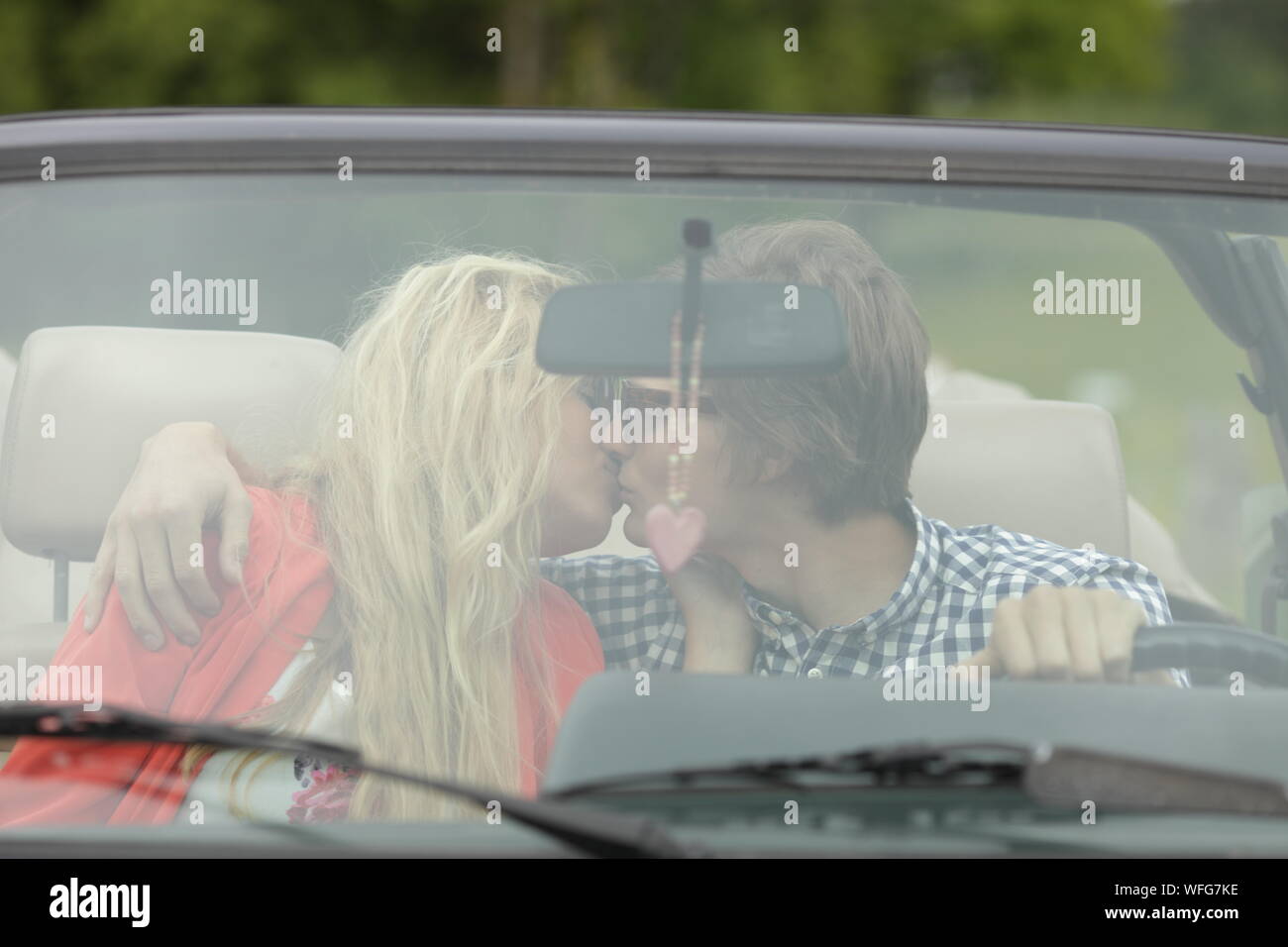 Couple Kissing In Car High Resolution Stock Photography and Images - Alamy