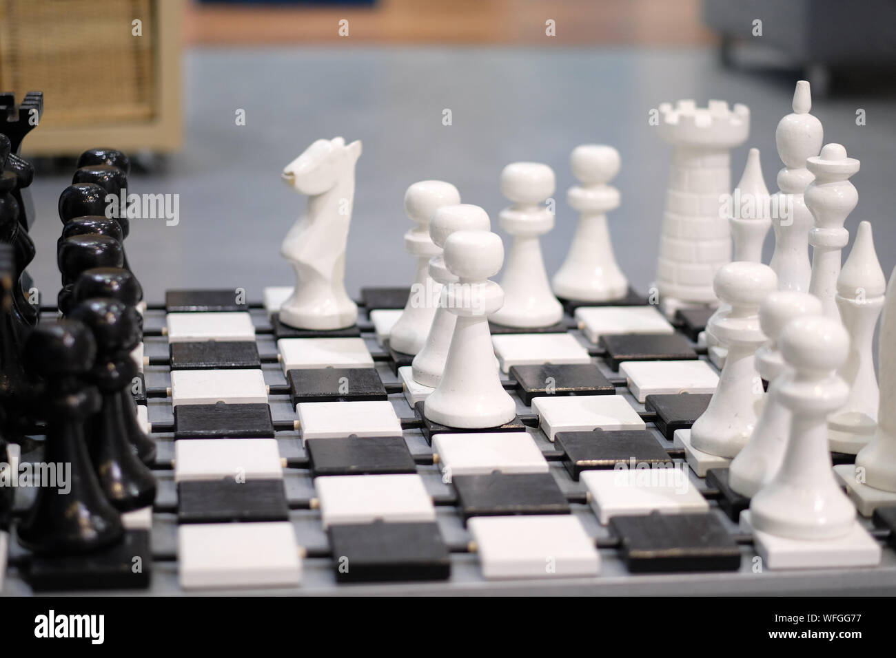 Chessboard with figures of large size in the center of entertaining ...