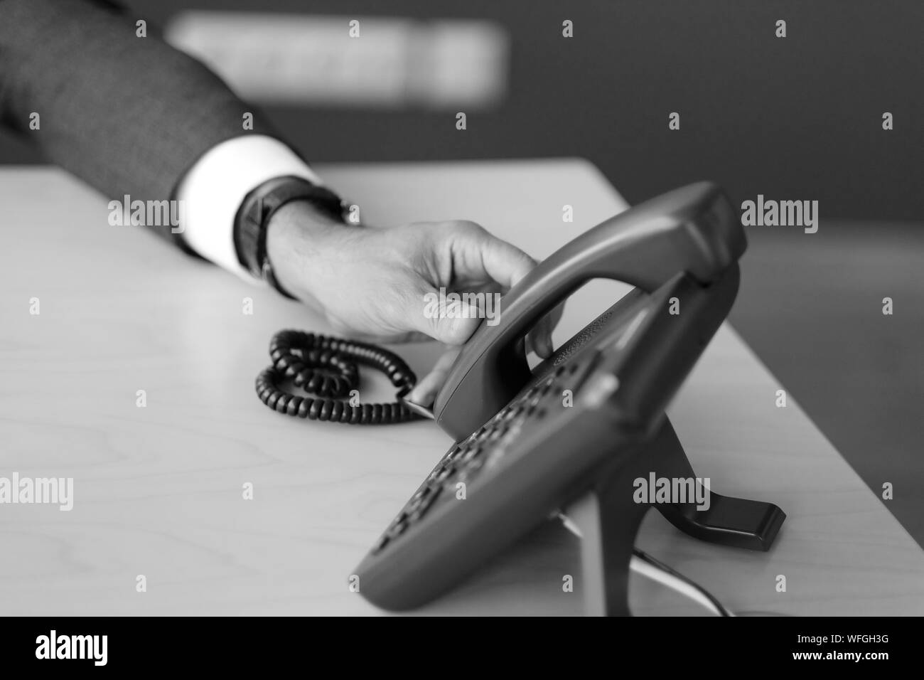 Hand of a man with a fixed telephone in the office Stock Photo - Alamy